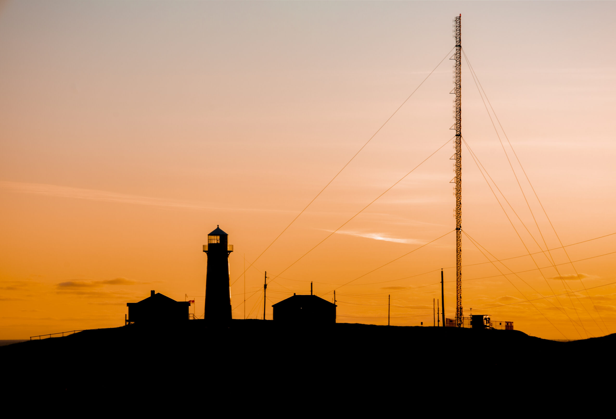 Sunset at Cape Pine lighthouse - Downhome Magazine